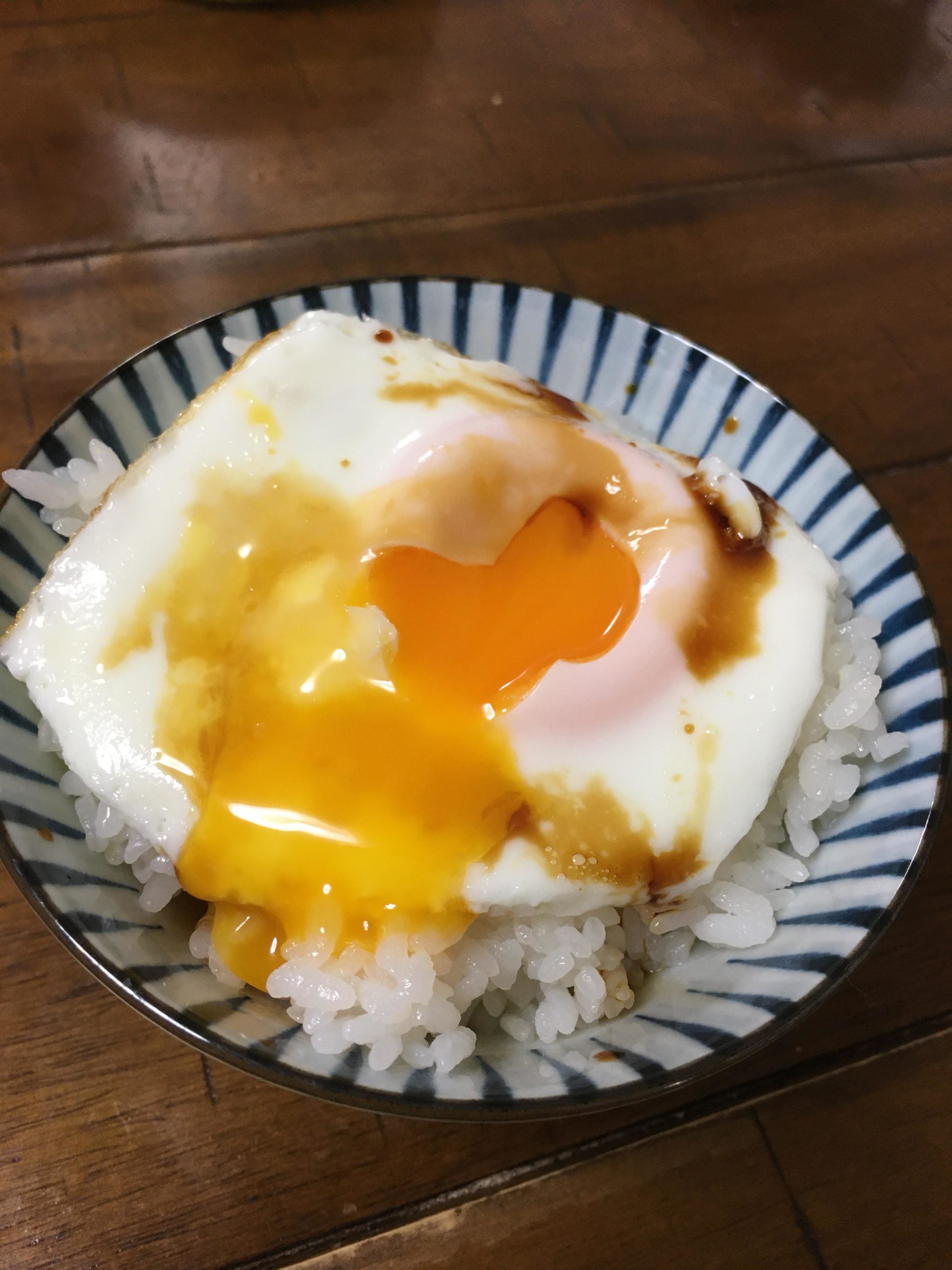 Nothing special, just an egg on a rice, sunny side up. Simple. - Alo Japan