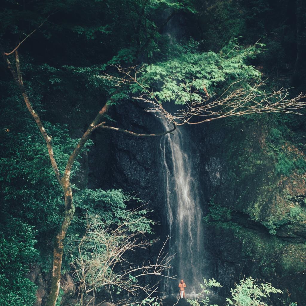 Buddhist meditating under waterfall. - Alo Japan All About Japan