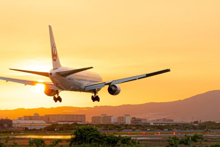 Japan Airline: . The setting sun shines across the rocky terrain at the ...